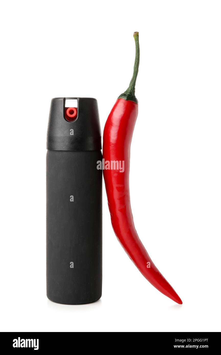 Spray with chili pepper on white background Stock Photo - Alamy