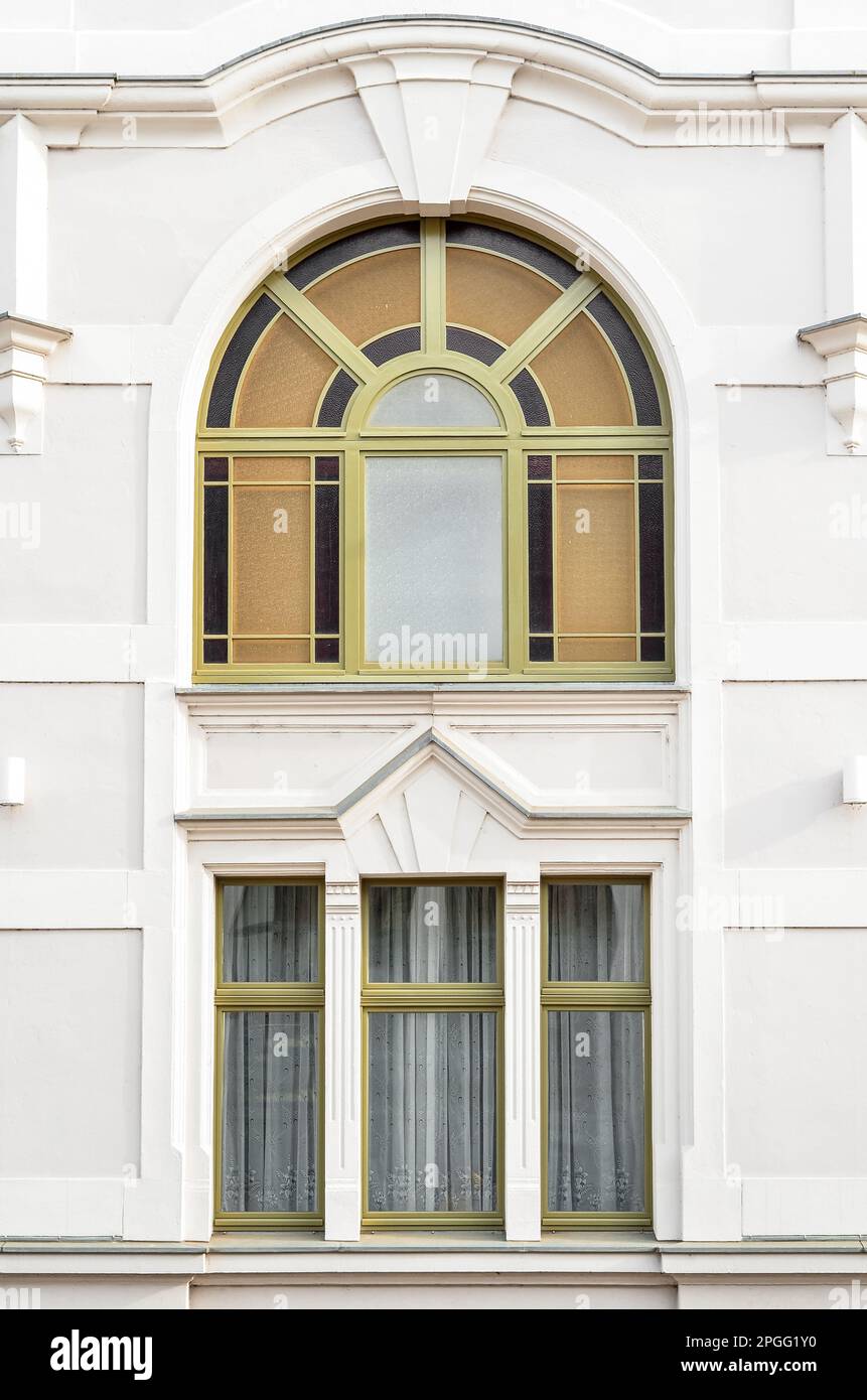 View of white building with windows Stock Photo - Alamy