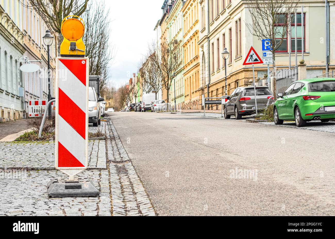 View of road divider on city street Stock Photo - Alamy