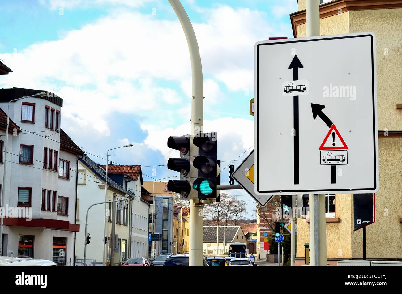 View of road signs and traffic lights in city Stock Photo - Alamy