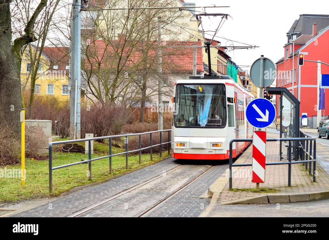 View of city street with tramway and road signs Stock Photo - Alamy