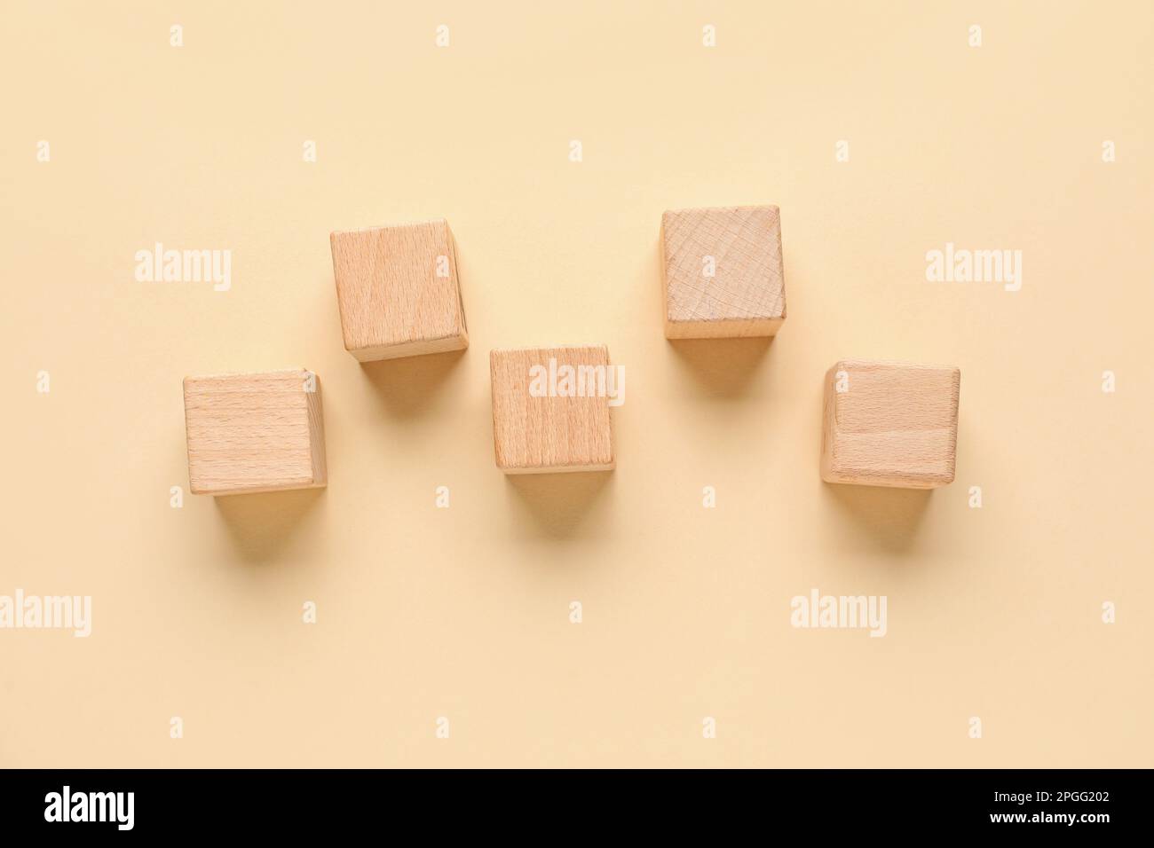 Wooden cubes with check marks on beige background Stock Photo - Alamy