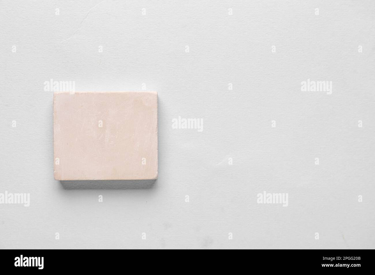 Block with check mark on grey background Stock Photo - Alamy