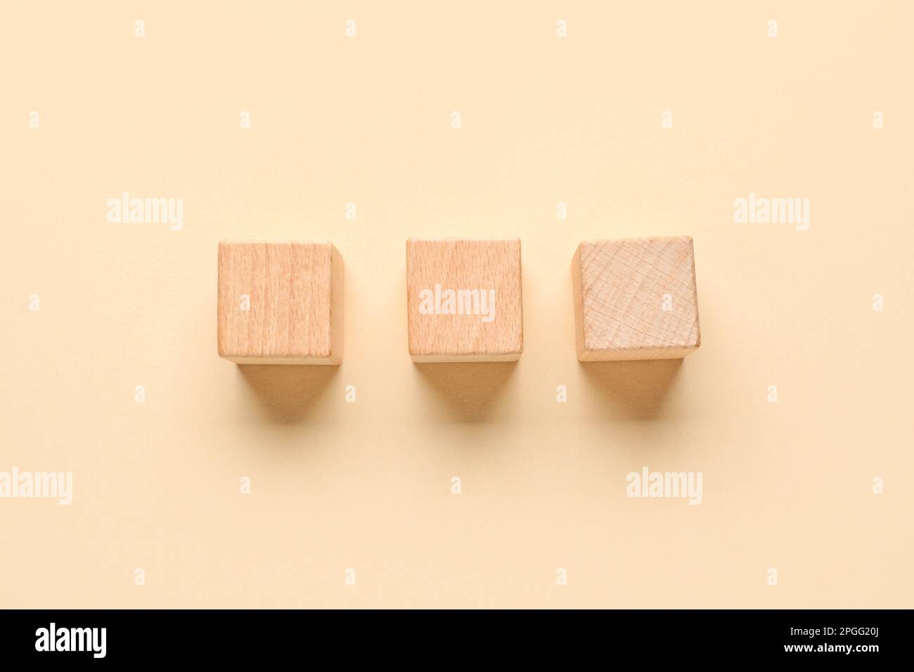 Wooden cubes with check marks on beige background Stock Photo - Alamy