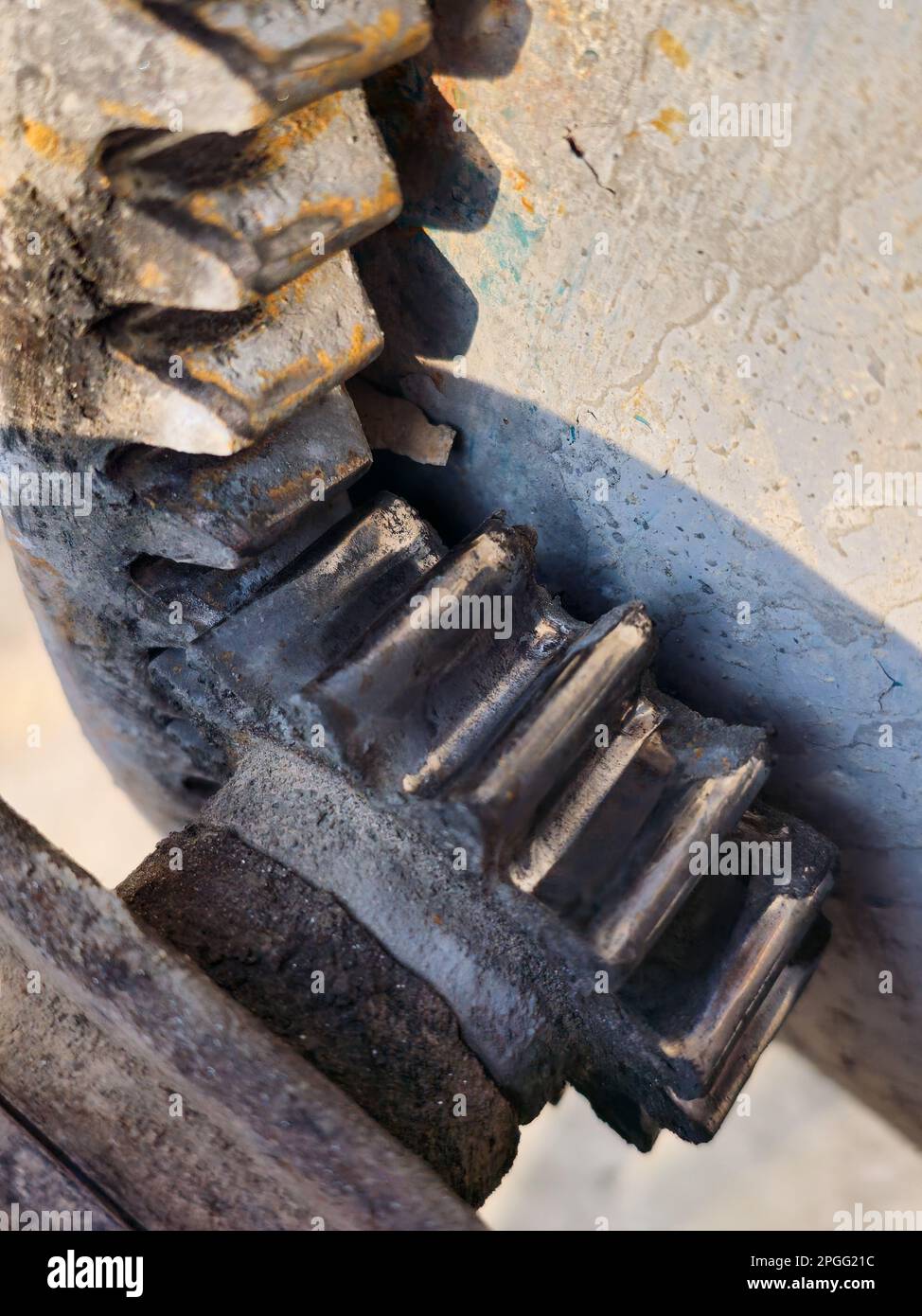 The gearing mechanism of the gearbox of a small concrete mixer Stock ...