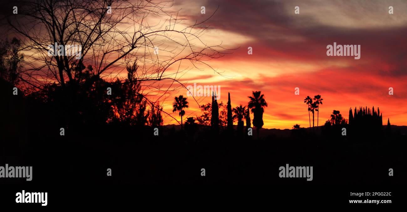 A stunning red sky illuminated by a magnificent sunset Stock Photo - Alamy