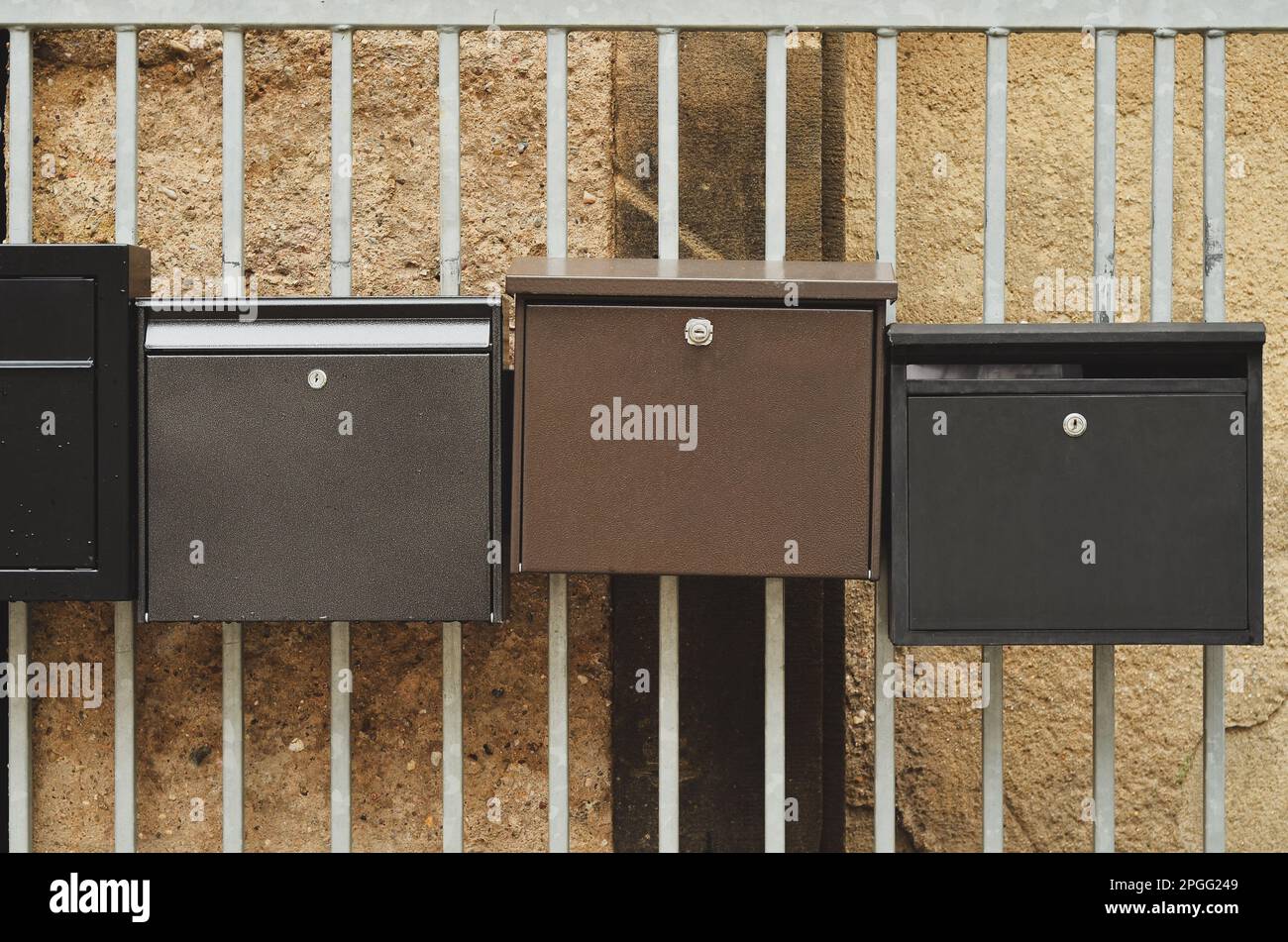 View of mailboxes on fence outdoors Stock Photo - Alamy