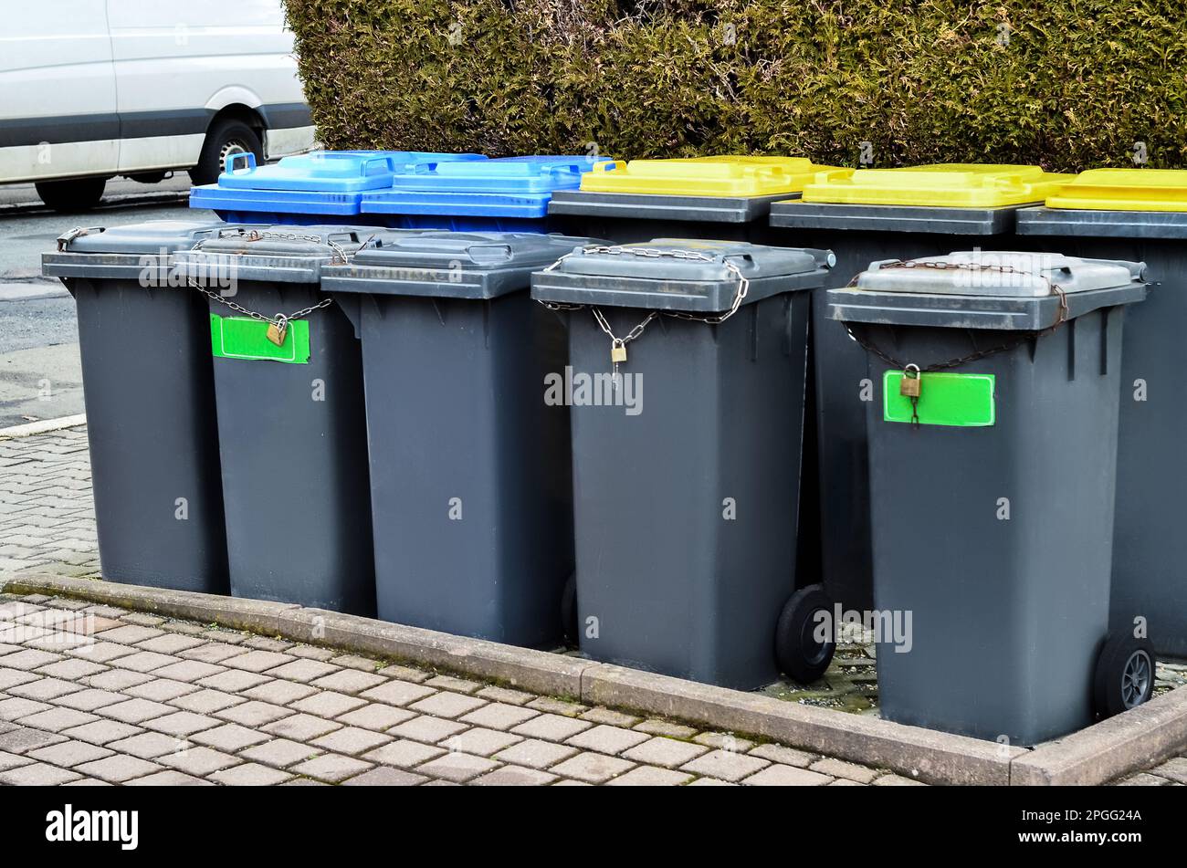 Garbage containers on city street Stock Photo - Alamy
