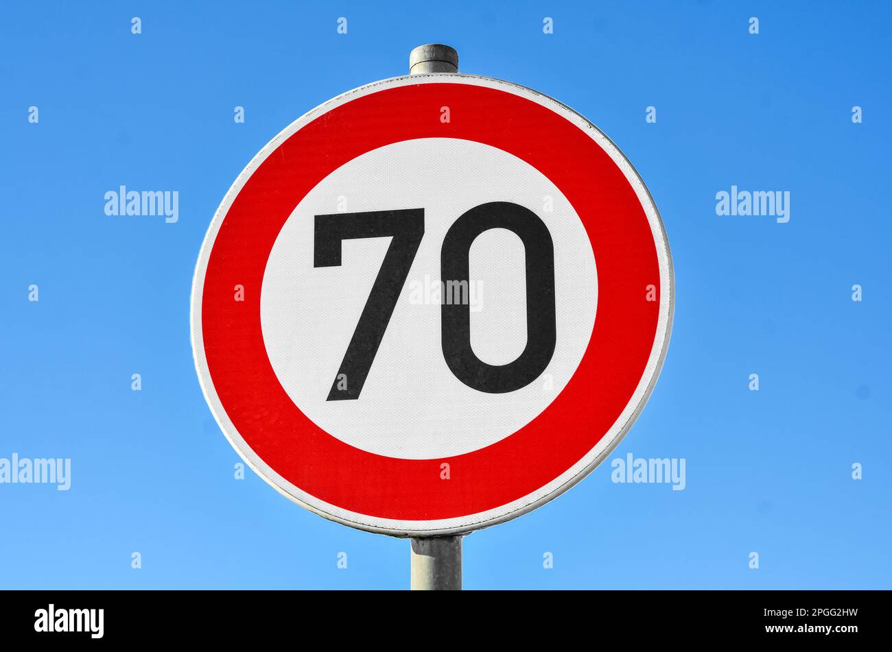 Speed limit 70 sign against blue sky, closeup Stock Photo - Alamy