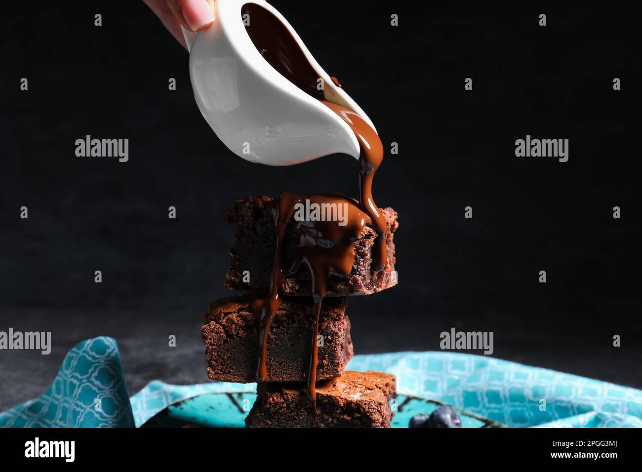 Woman pouring topping onto hi-res stock photography and images - Alamy