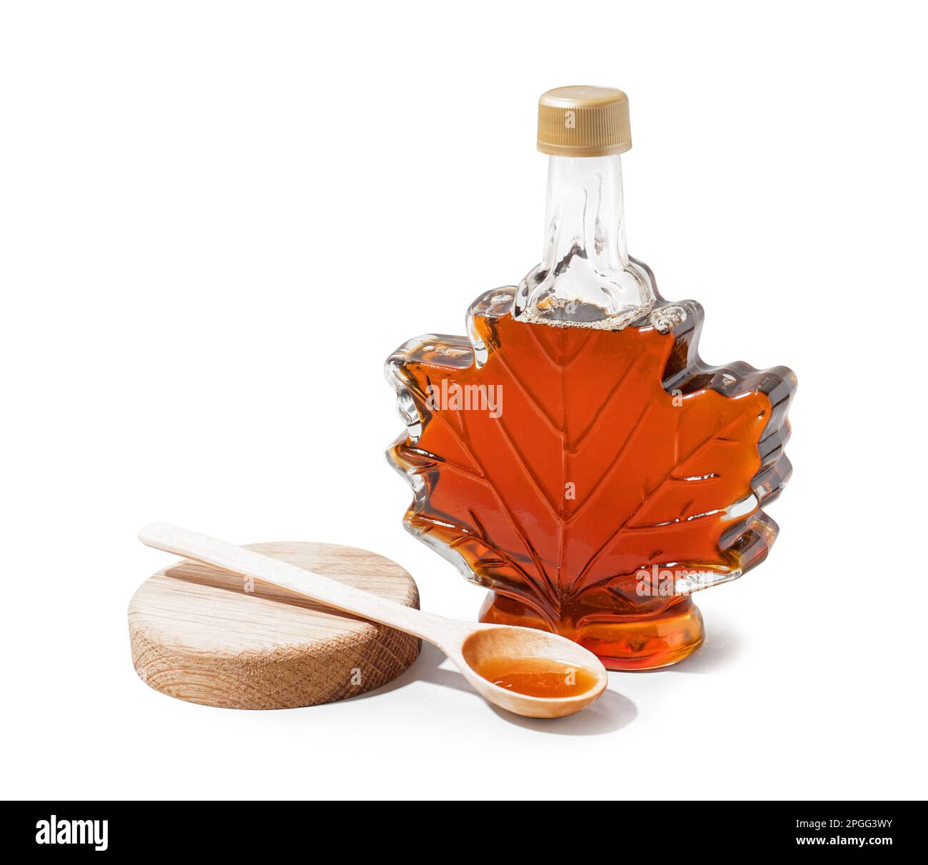 Bottle and spoon of tasty maple syrup on grey background Stock Photo ...