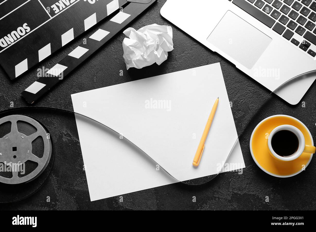 Blank paper sheet with movie clapper, film reel and cup of coffee on ...