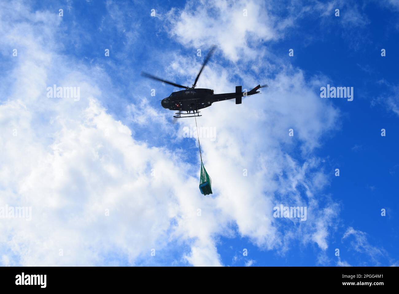 A Montenegrin Air Force helicopter carries a sling load resupply to ...