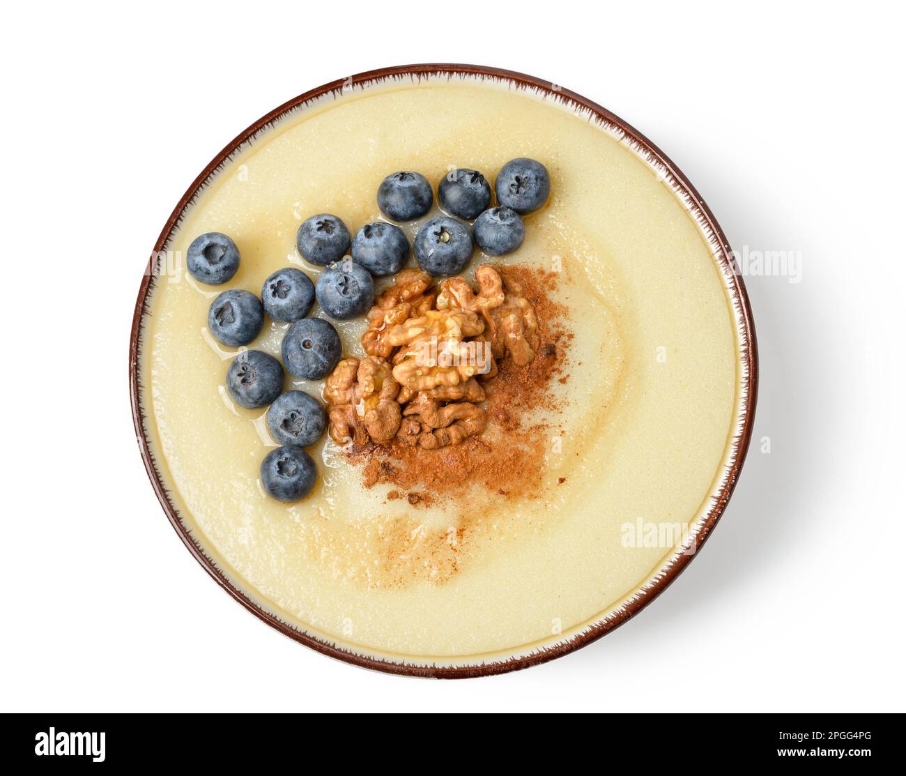 Bowl of tasty semolina porridge with blueberry and nuts on white ...
