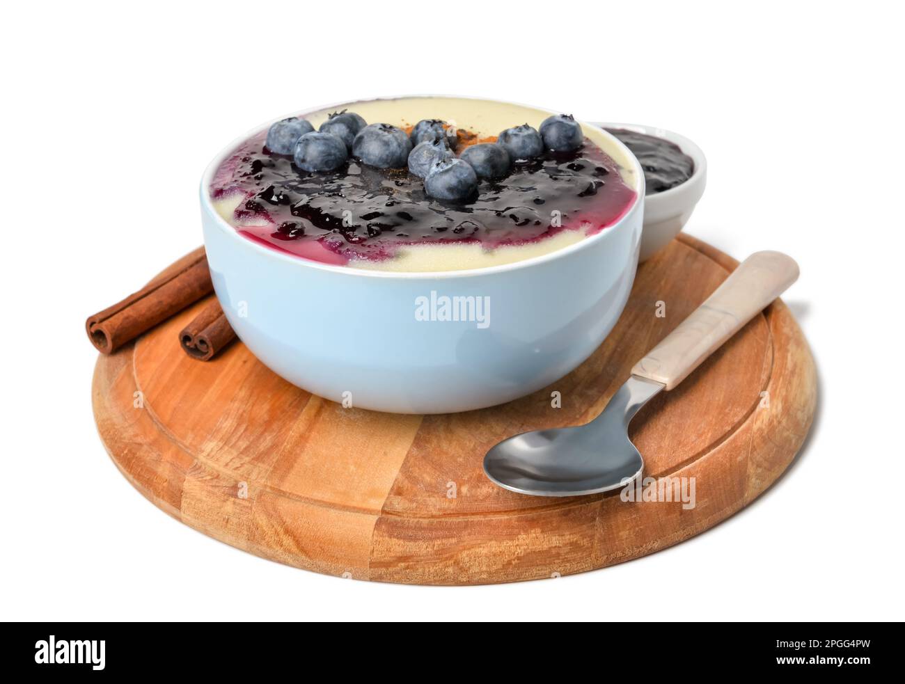 Bowl of tasty semolina porridge with blueberry jam and cinnamon on ...