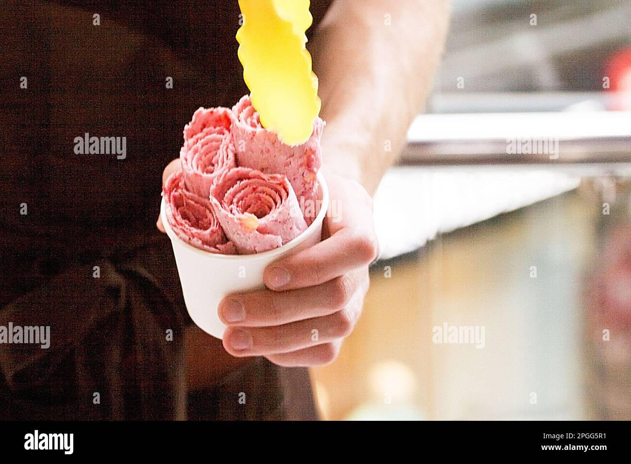 To put an ice cream roll in a glass Stock Photo - Alamy
