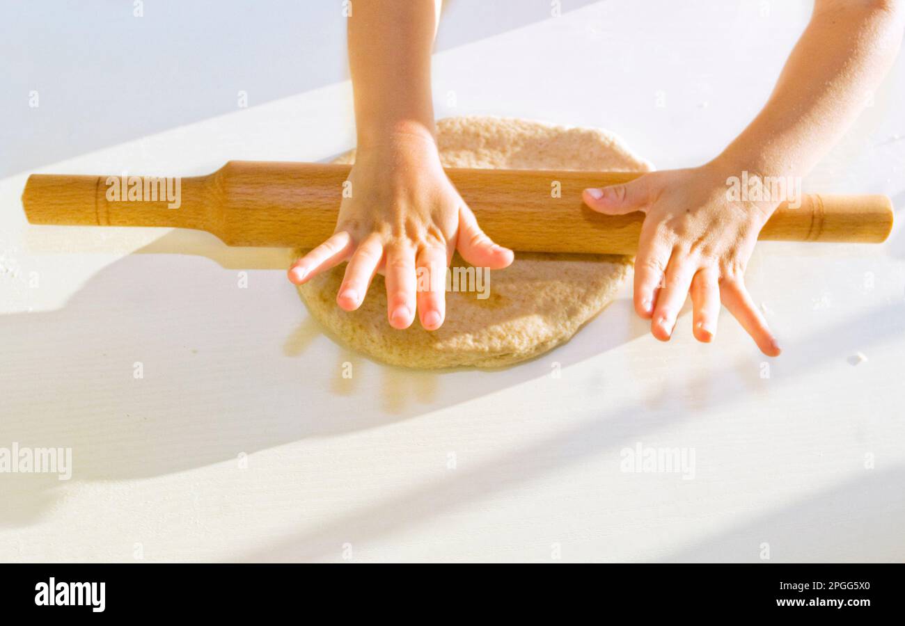 Small knobs roll out the dough in the sun's rays Stock Photo - Alamy