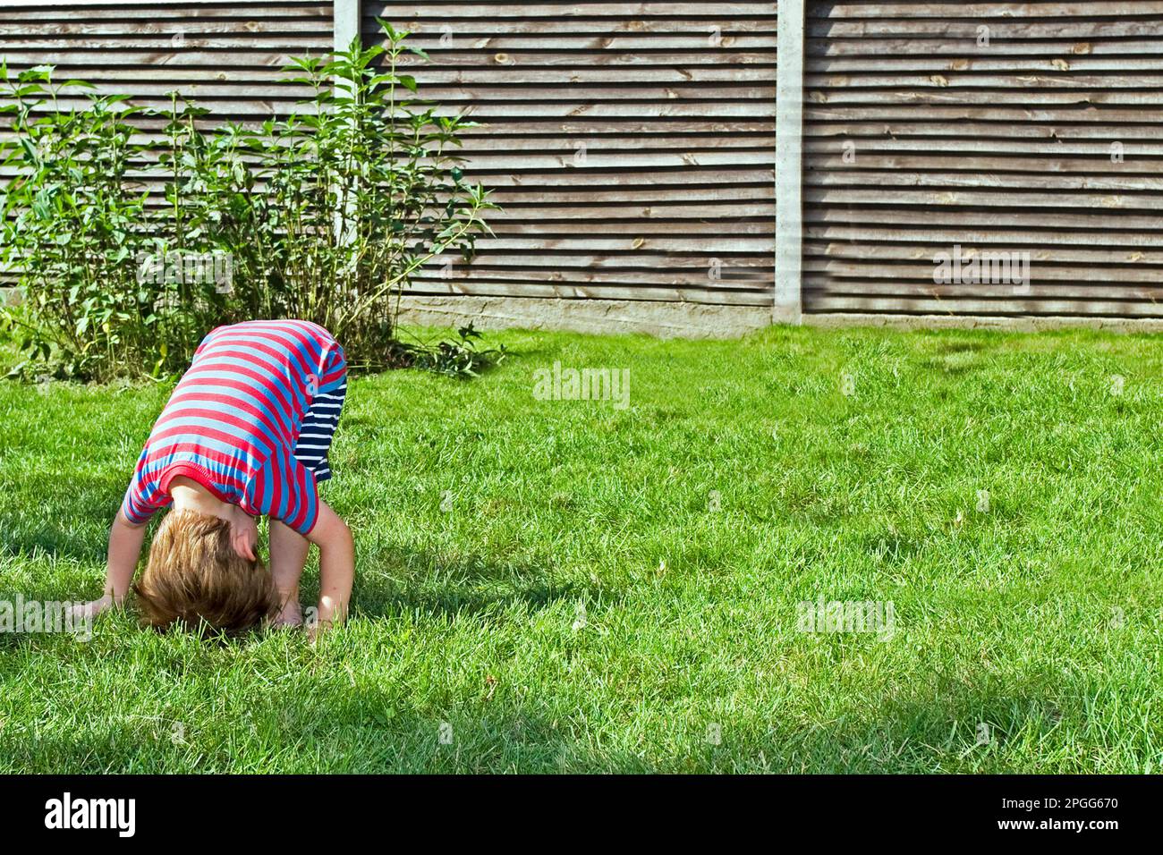 somersault stand upside down Stock Photo - Alamy
