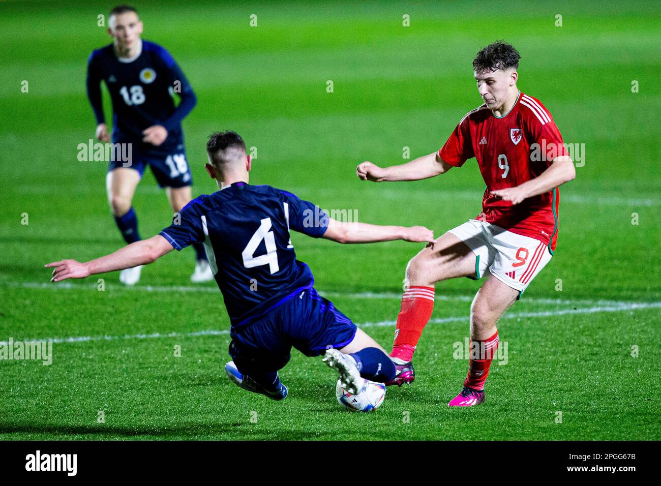 Newport, UK. 22nd Mar, 2023. Iwan Morgan of Wales is tackled by Dylan ...