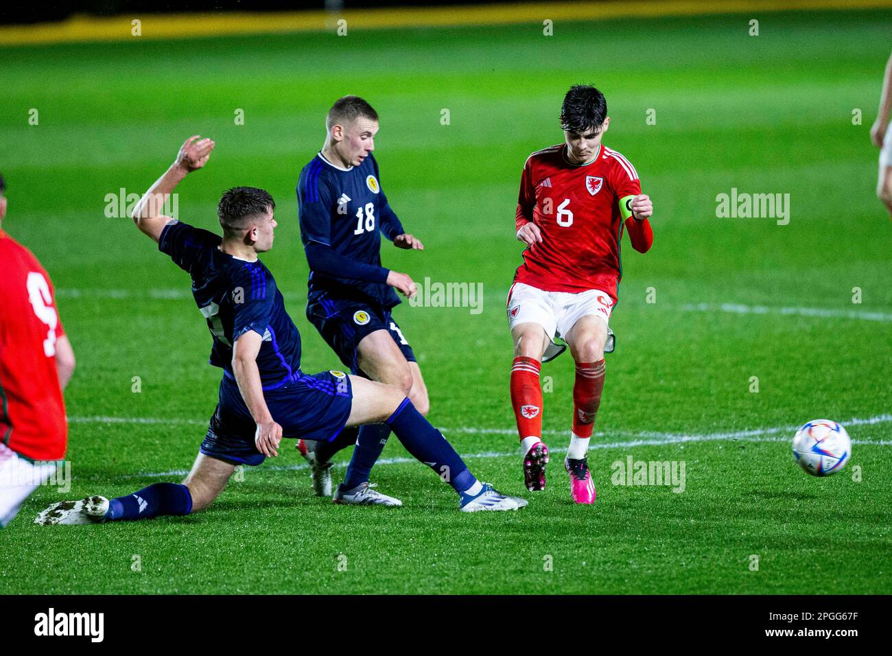 Newport, UK. 22nd Mar, 2023. Charlie Crew of Wales is tackled by Kyle ...