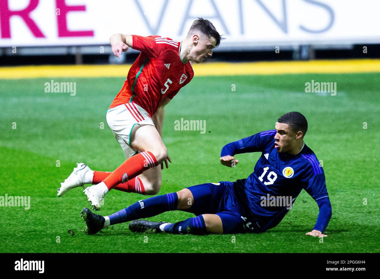 Newport, UK. 22nd Mar, 2023. Ryan One of Scotland tackles Dylan Lawlor ...