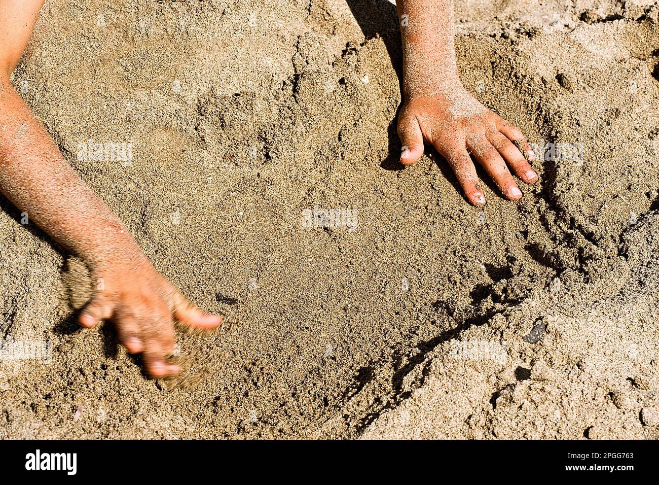 children's fingers are playing on the sand Stock Photo - Alamy