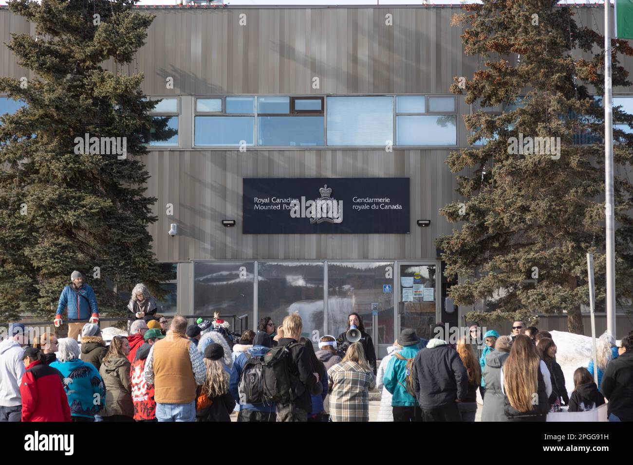 Whitehorse, Canada. 22nd Mar, 2023. People gather in front of the RCMP ...
