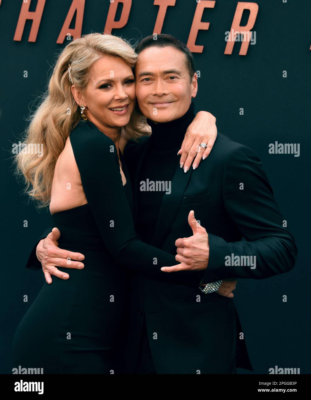 Hollywood, California, USA 20th March 2023 (L-R) Julie Condra and Actor Mark Dacascos attend the ...