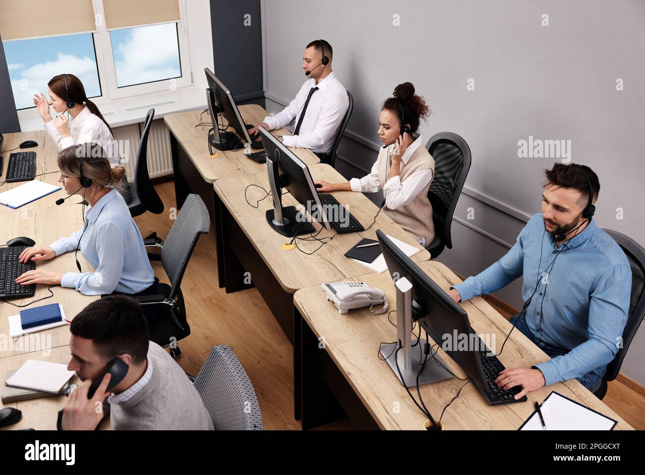 Call center operators working in modern office, above view Stock Photo ...