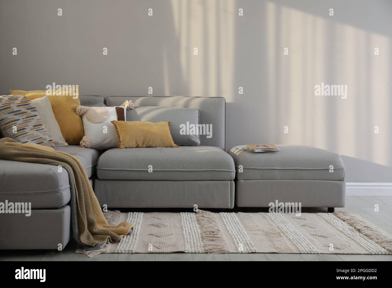 Living room interior with large grey sofa Stock Photo - Alamy