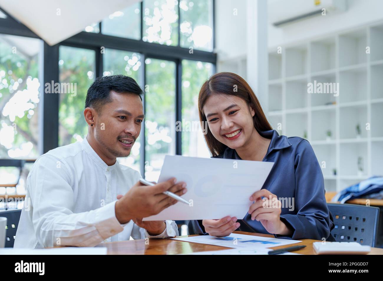 startup business, portrait of two entrepreneurs using computers and ...
