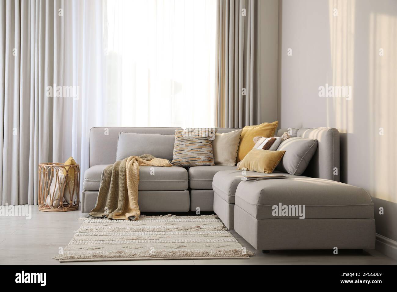 Living room interior with large grey sofa Stock Photo - Alamy