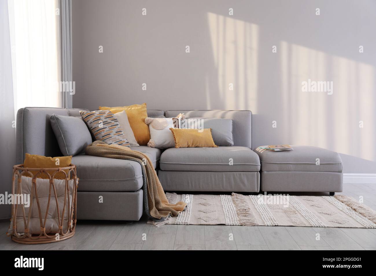 Living room interior with large grey sofa Stock Photo - Alamy