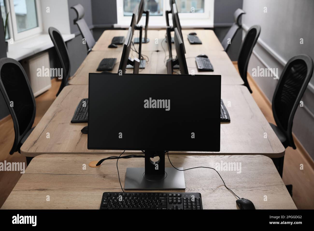 Rows of computers in empty office hi-res stock photography and images ...