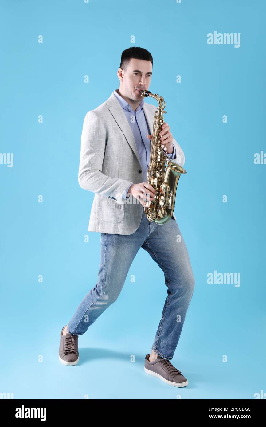 Playing saxophone man performing blue hi-res stock photography and ...