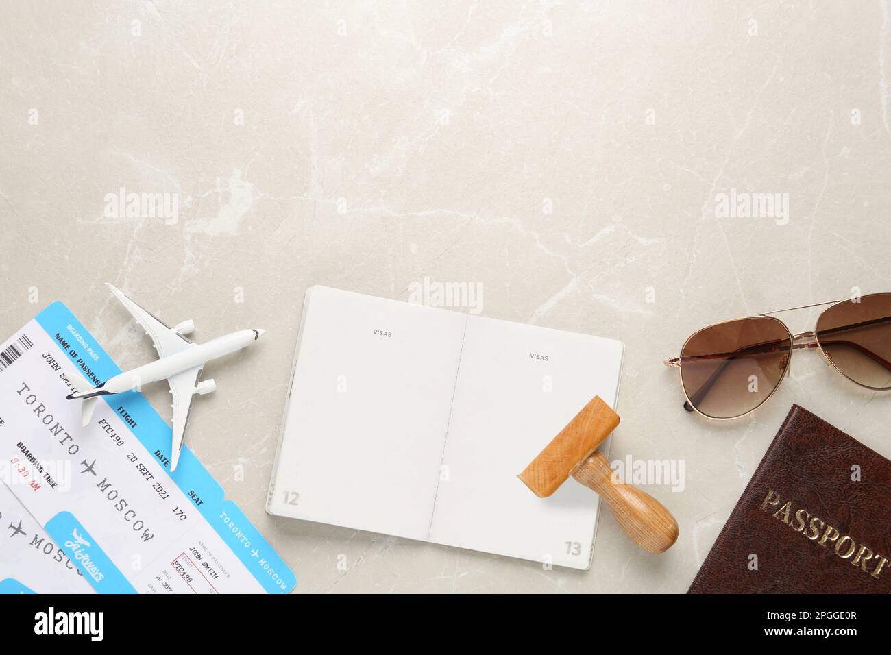 Flat lay composition with passports, stamp and flight tickets on light ...