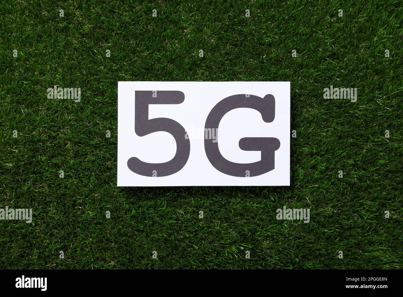 5G technology, Internet concept. Card on green grass, top view Stock ...