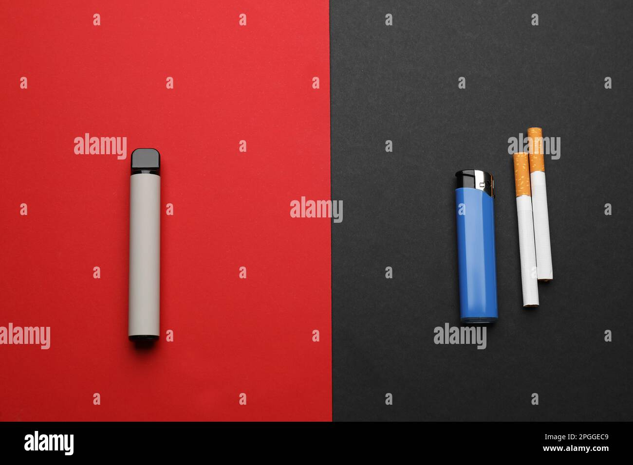 Disposable electronic smoking device near lighter and cigarettes on ...