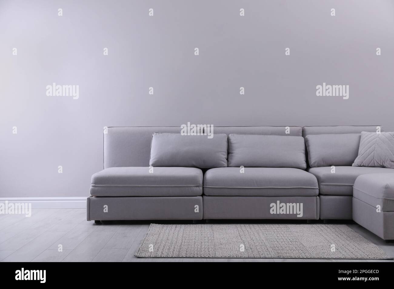 Large grey sofa in living room. Interior design Stock Photo - Alamy