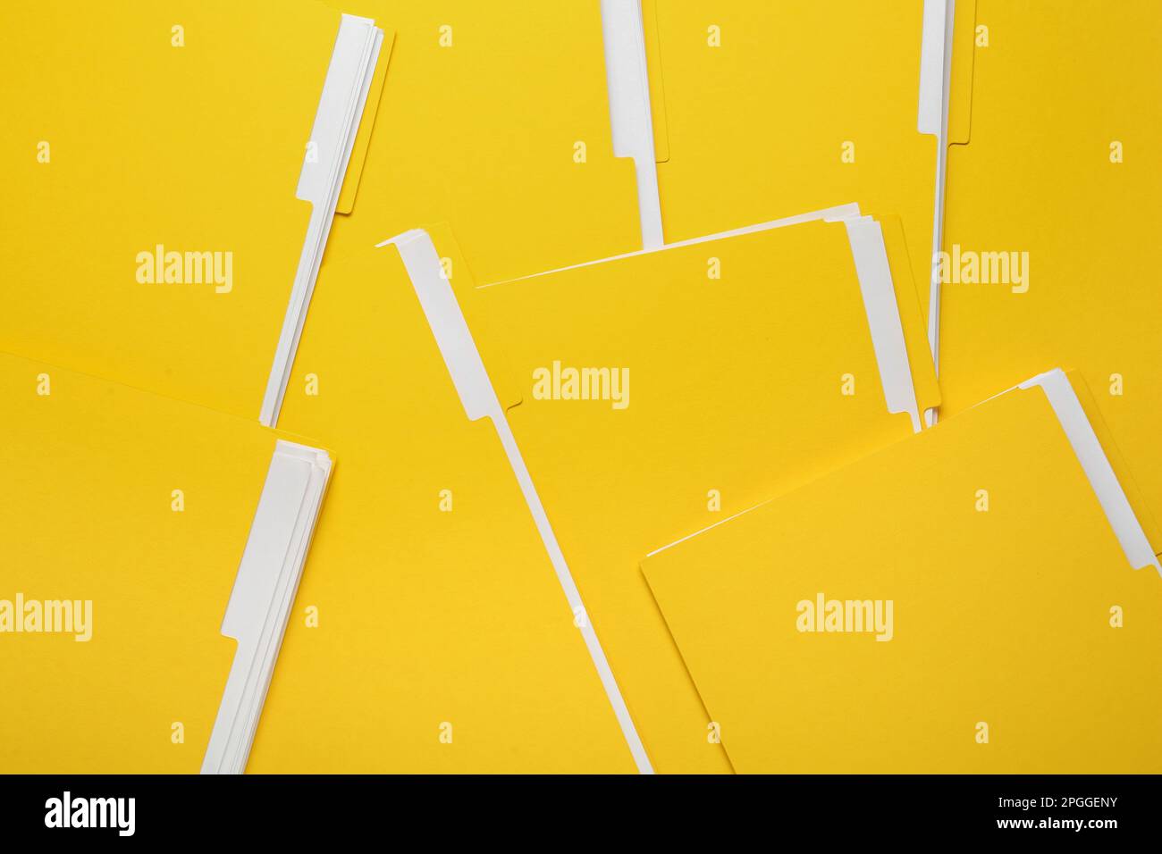 Many yellow files with documents as background, top view Stock Photo ...