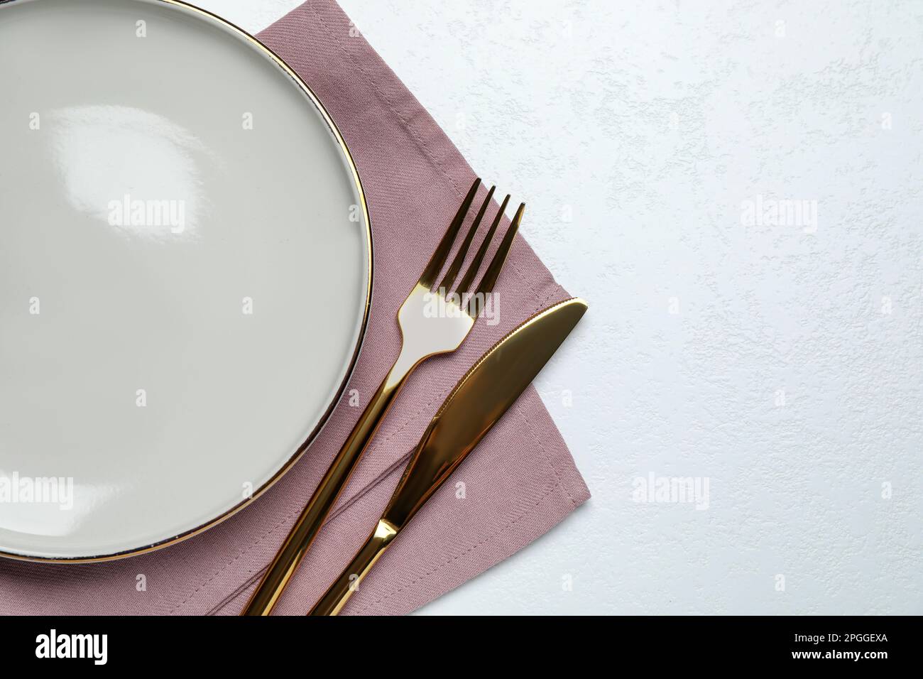Beautiful table setting on white background, flat lay. Space for text ...