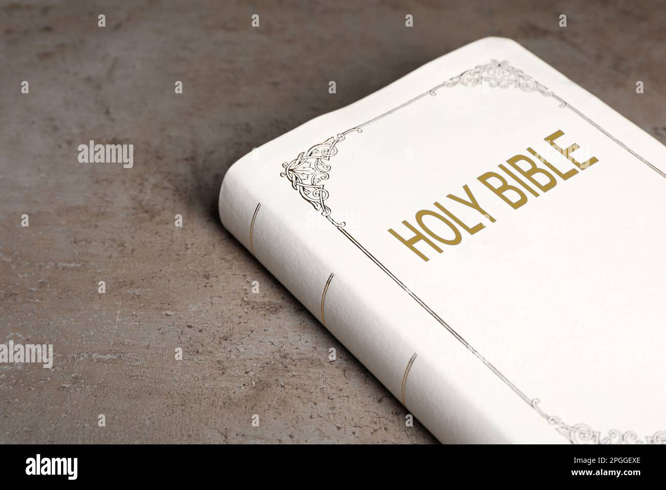 Bible with white cover on light grey table, closeup Stock Photo - Alamy