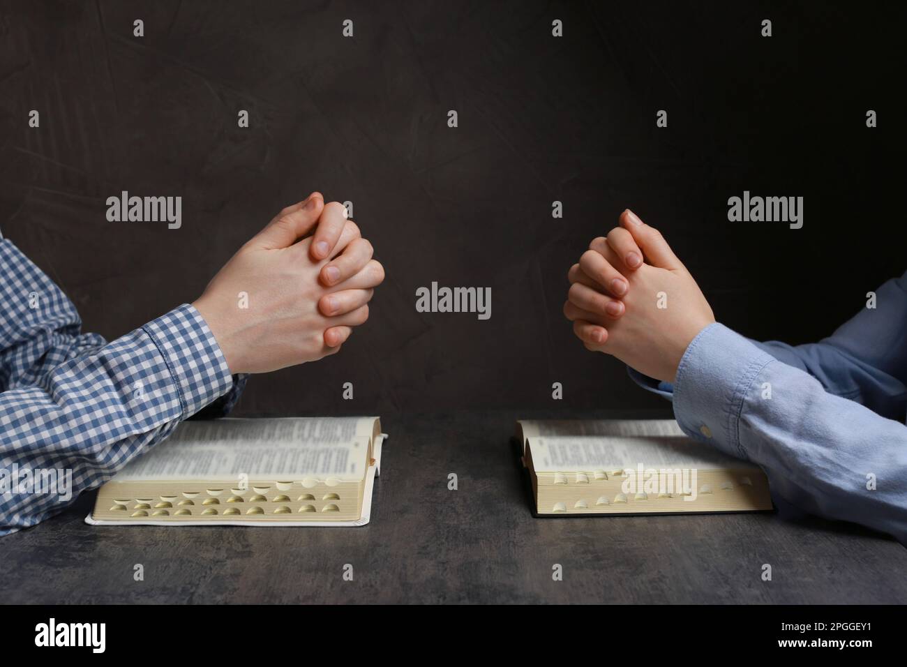 Adult woman praying over grey hi-res stock photography and images - Alamy