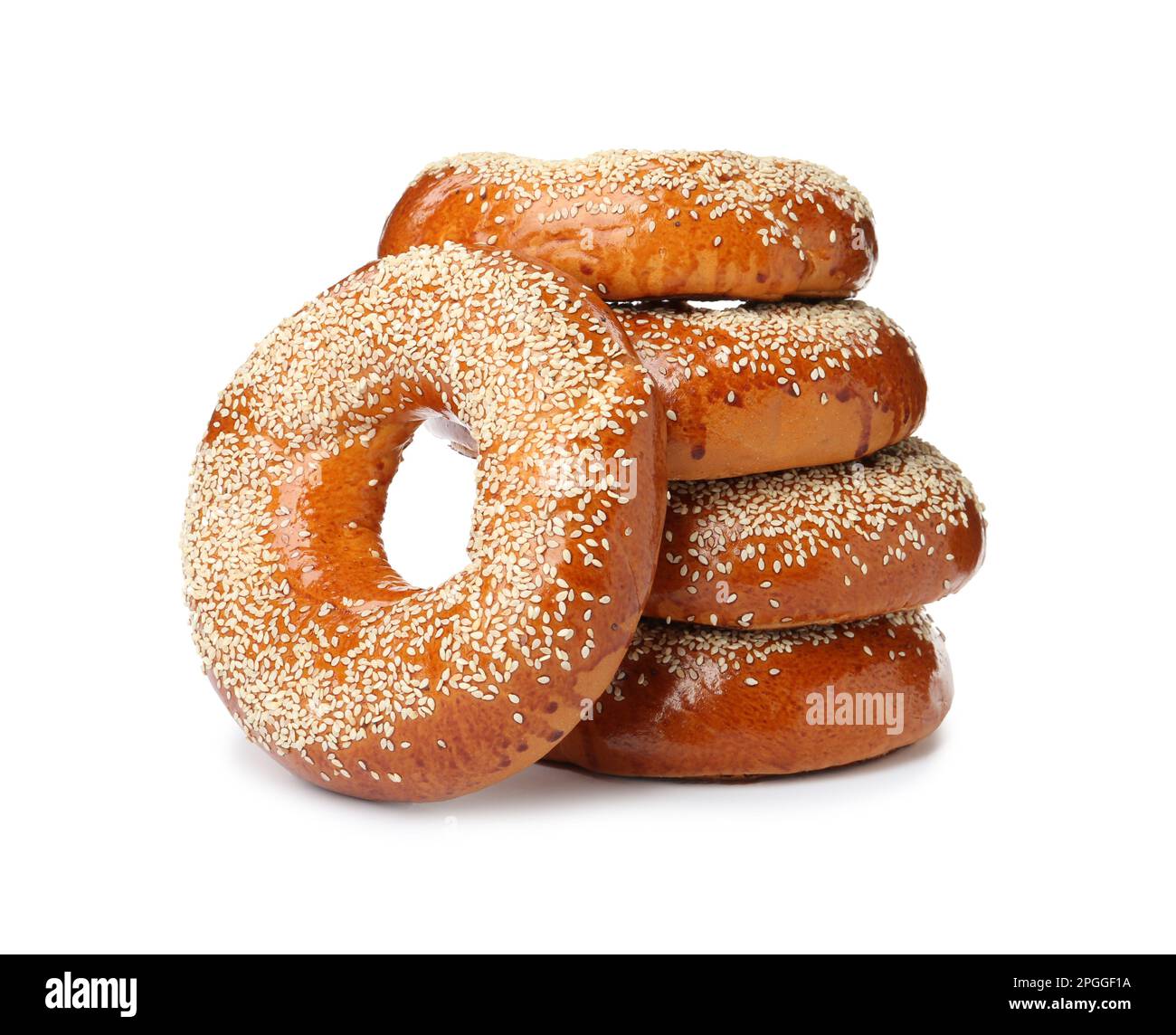 Many delicious fresh bagels on white background Stock Photo - Alamy