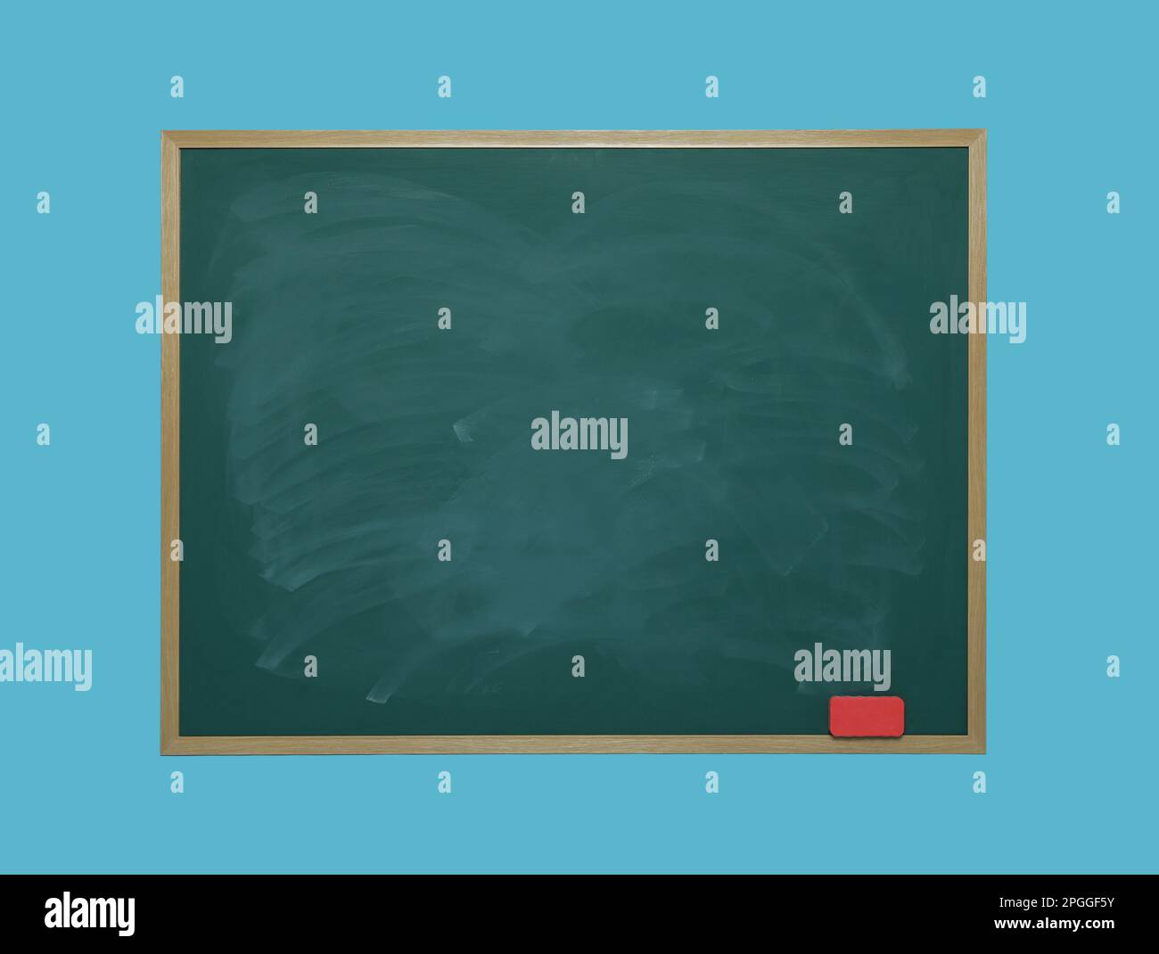 Dirty green chalkboard with duster on light blue background Stock Photo ...