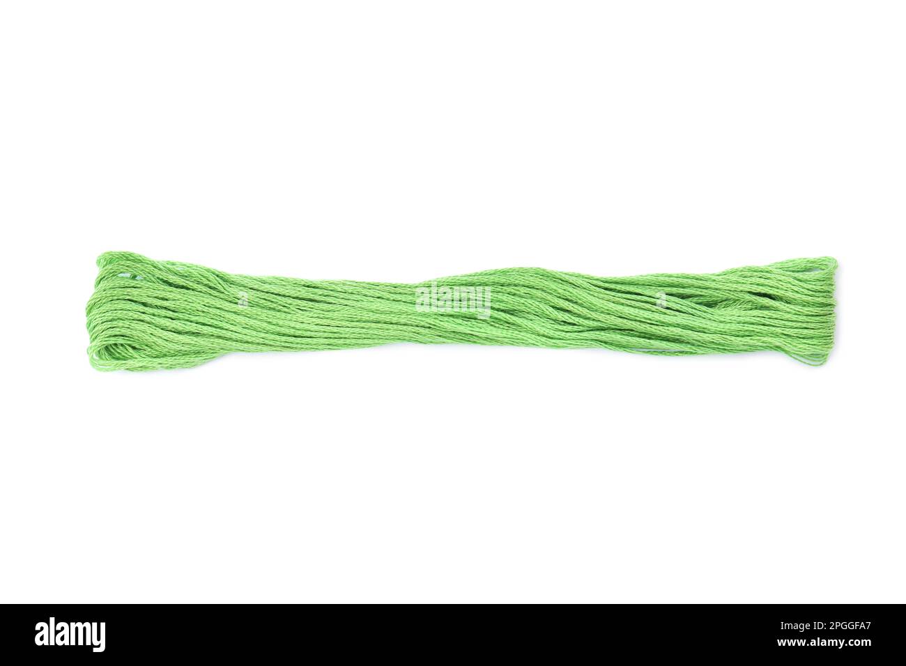 Light green embroidery thread on white background Stock Photo - Alamy