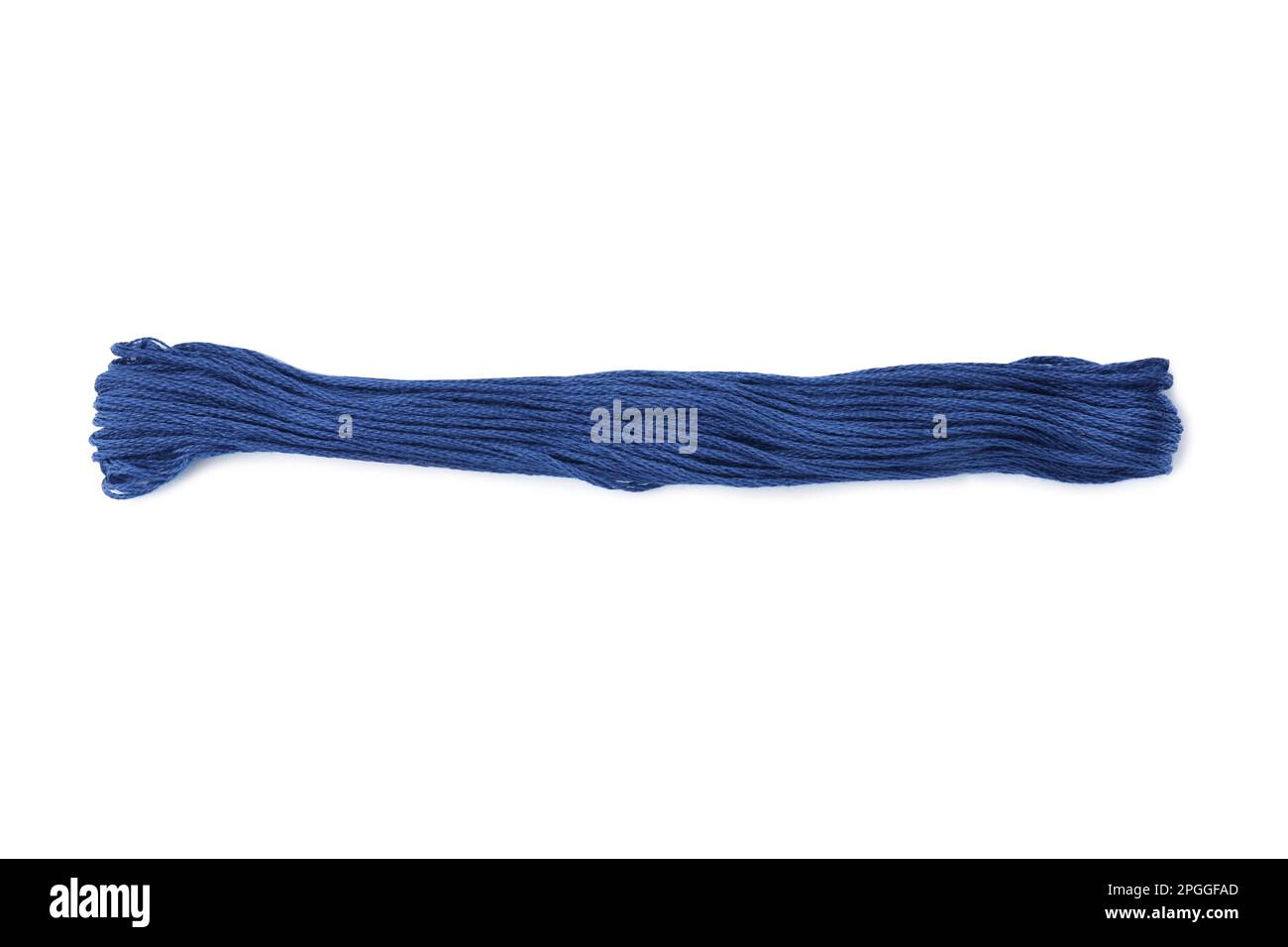 Bright blue embroidery thread on white background Stock Photo - Alamy