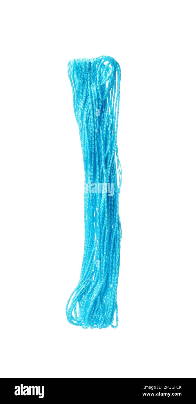 Light blue embroidery thread on white background Stock Photo - Alamy