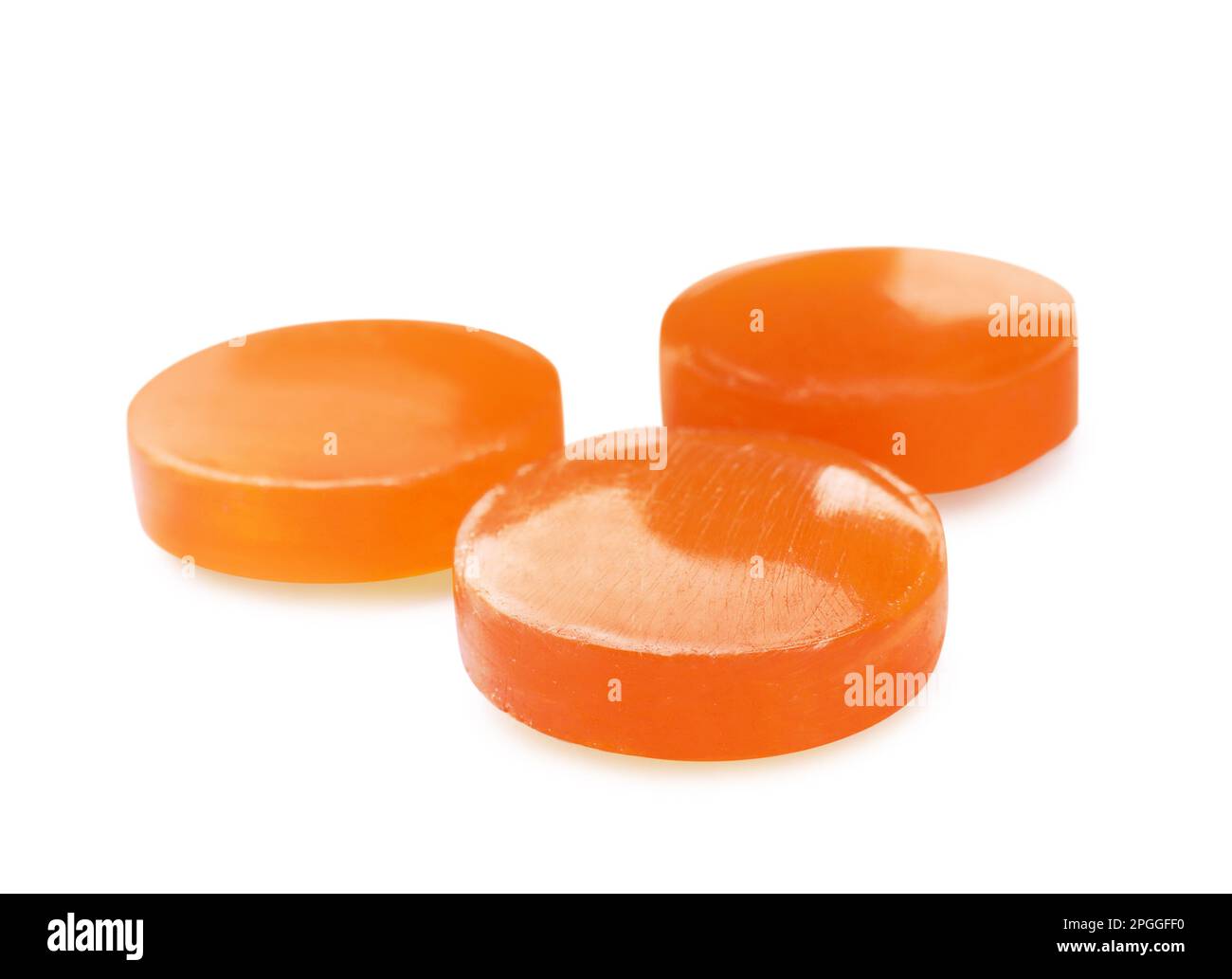 Orange cough drops on white background. Pharmaceutical product Stock ...