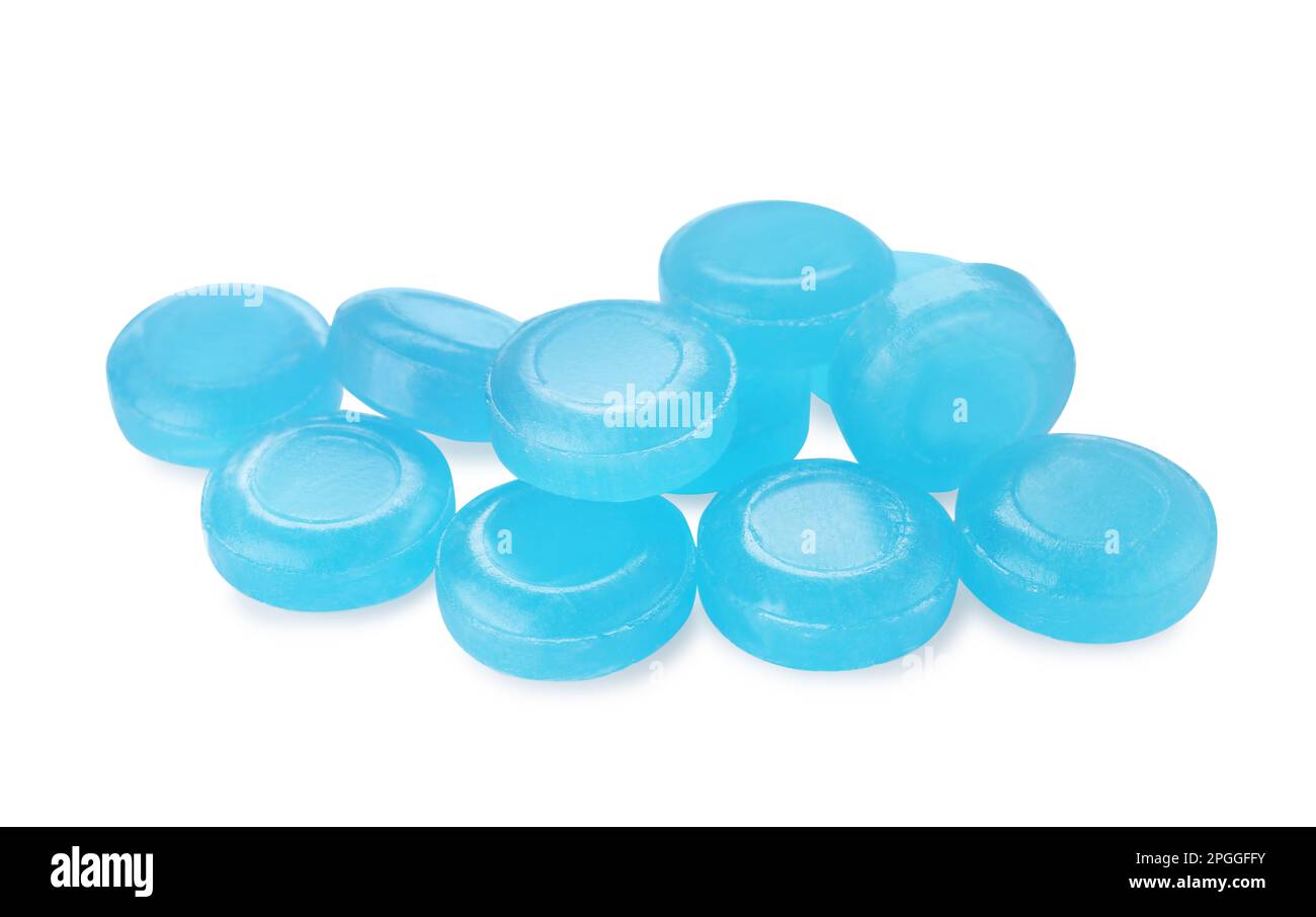 Many light blue cough drops on white background Stock Photo - Alamy